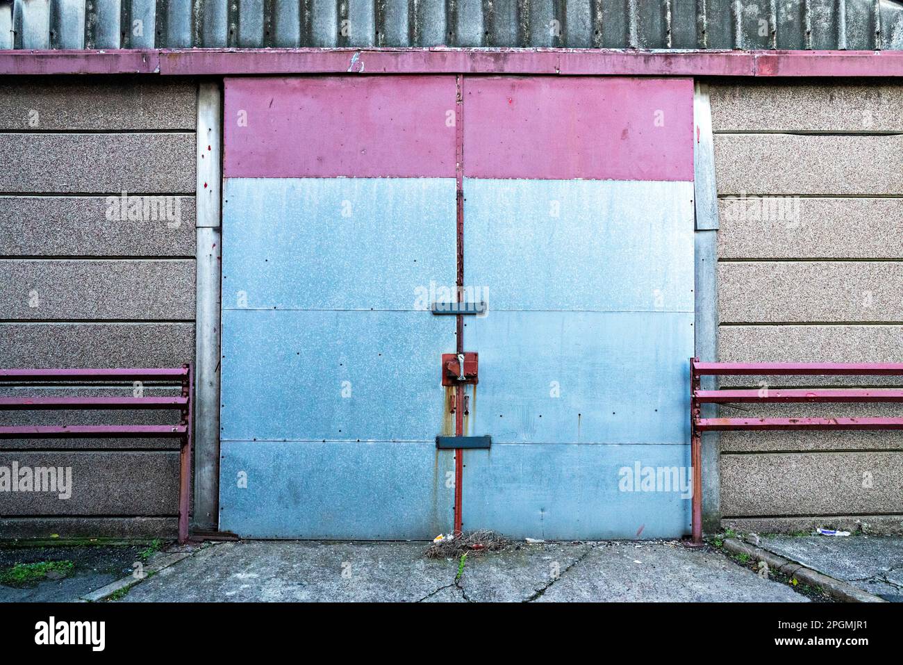 Metal double doors to storage facility Stock Photo - Alamy