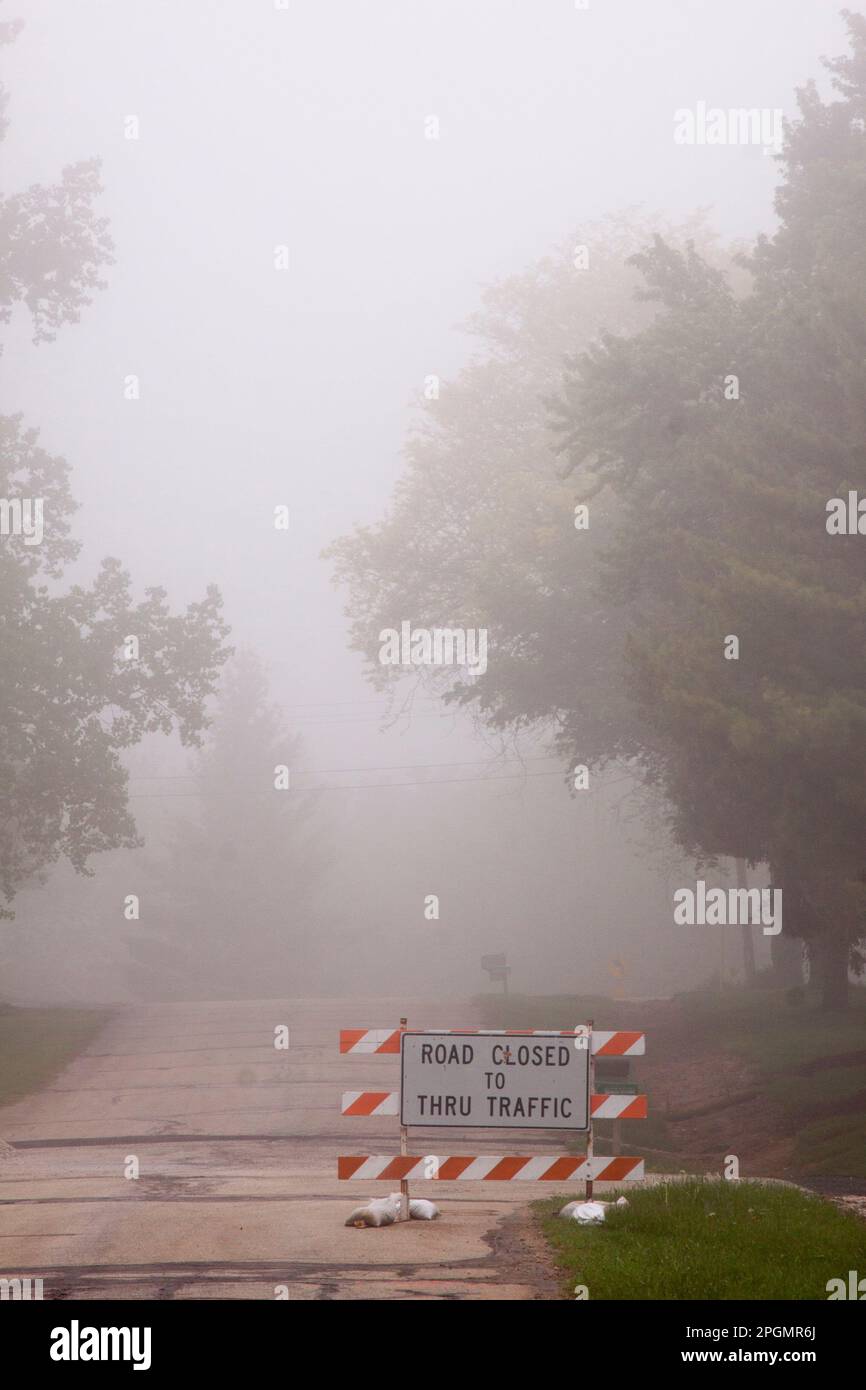 Road Construction Barricade in Fog with Closed to Thru Traffic Sign ...