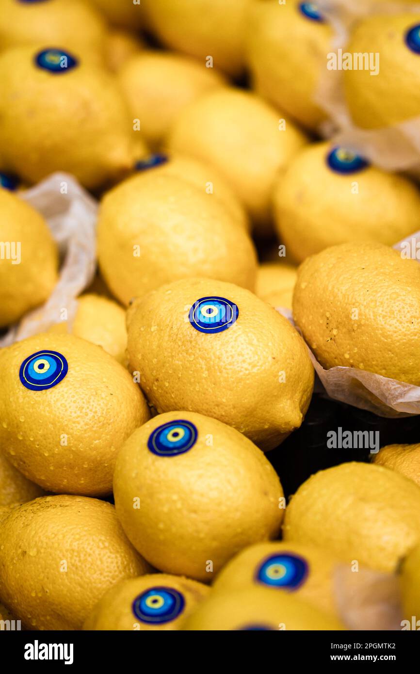 A stack of fresh lemons on a counter in an open marketplace Stock Photo ...