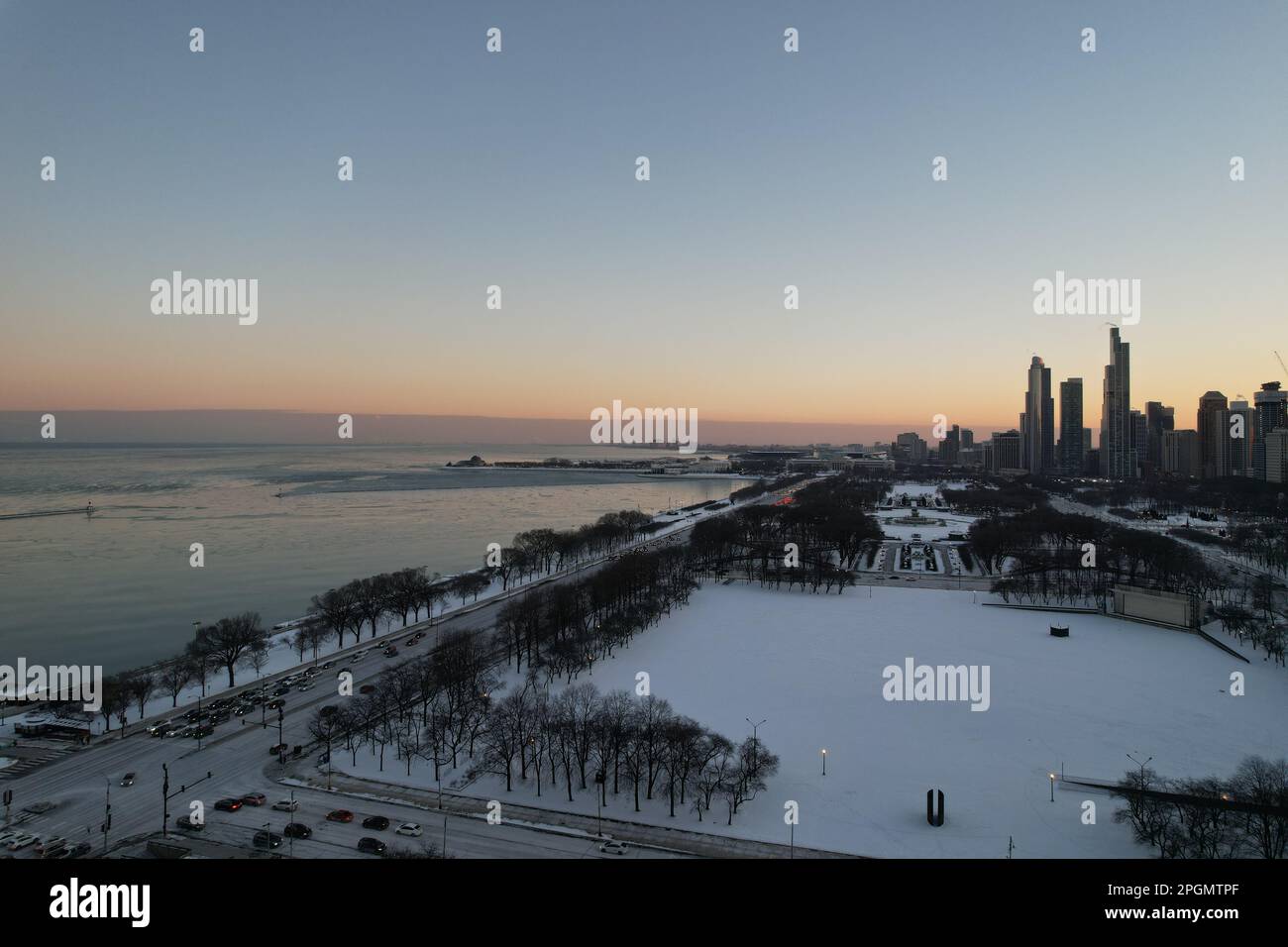Aerial view of Chicago at night, showcasing the illuminated skyline of ...
