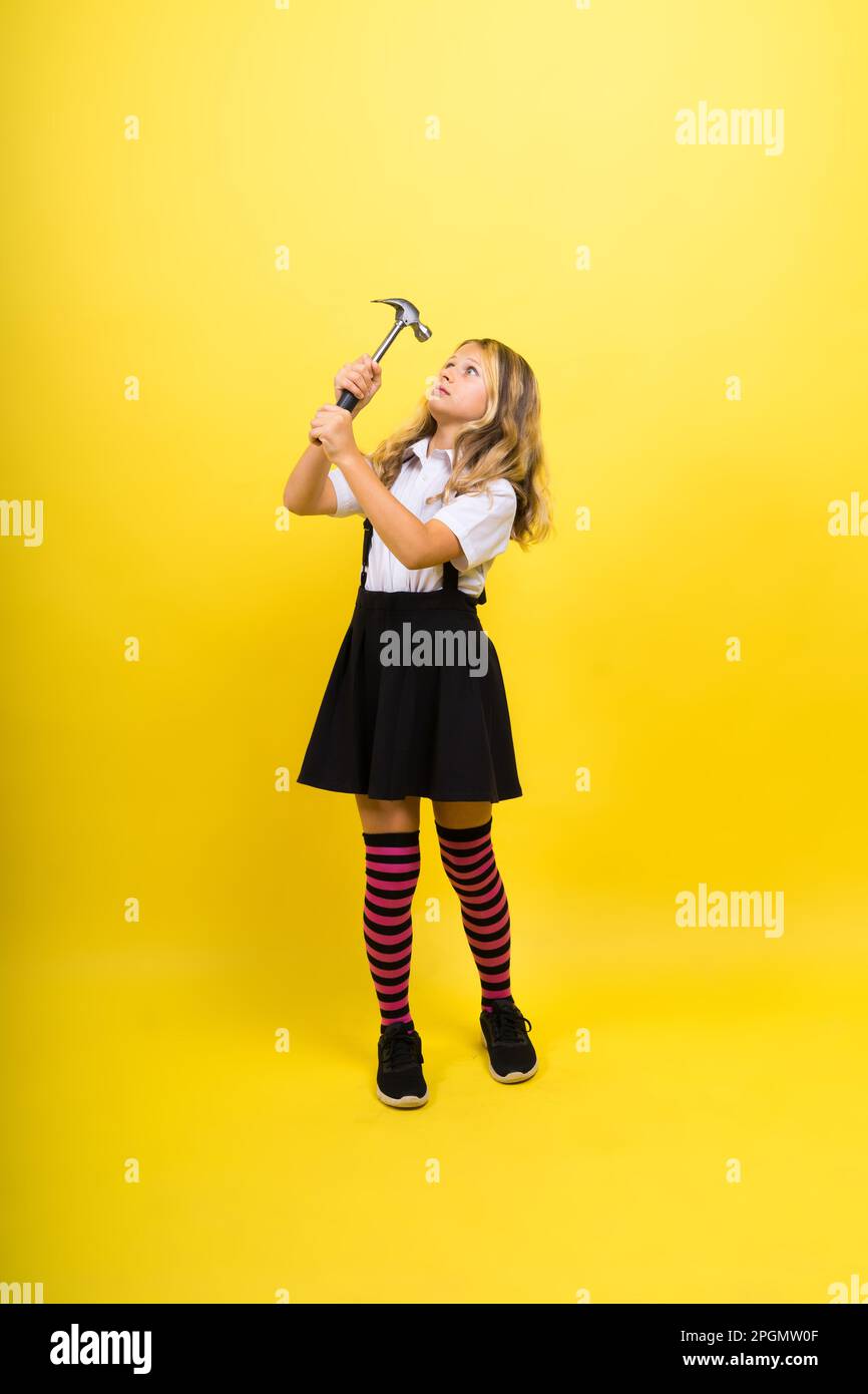 Future engineer. happy kid use a hammer repairing tool. building ...