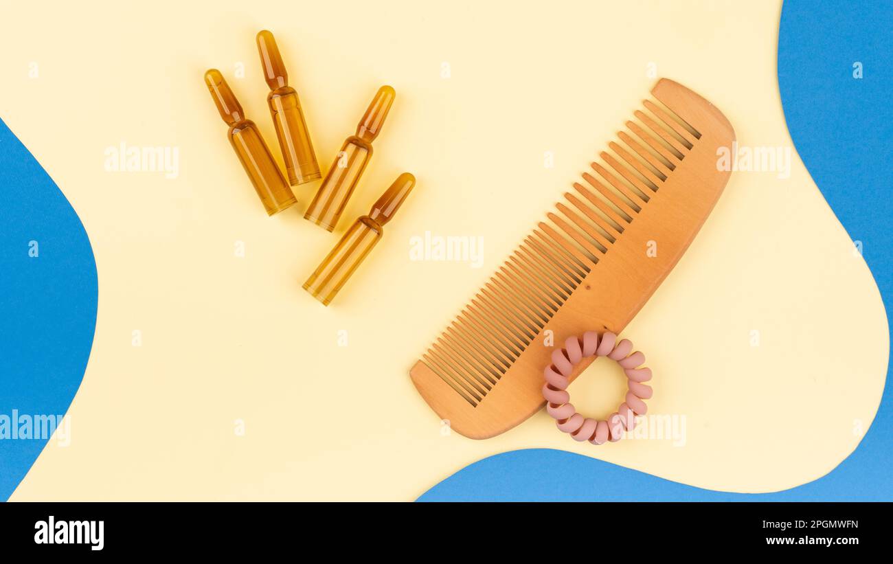Cosmetic ampoules with serum for hair growth, restoration. Hair comb ...
