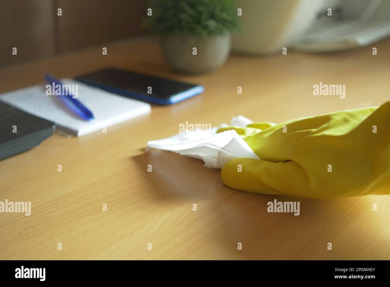 hand in rubber gloves cleaning table with cloth Stock Photo - Alamy