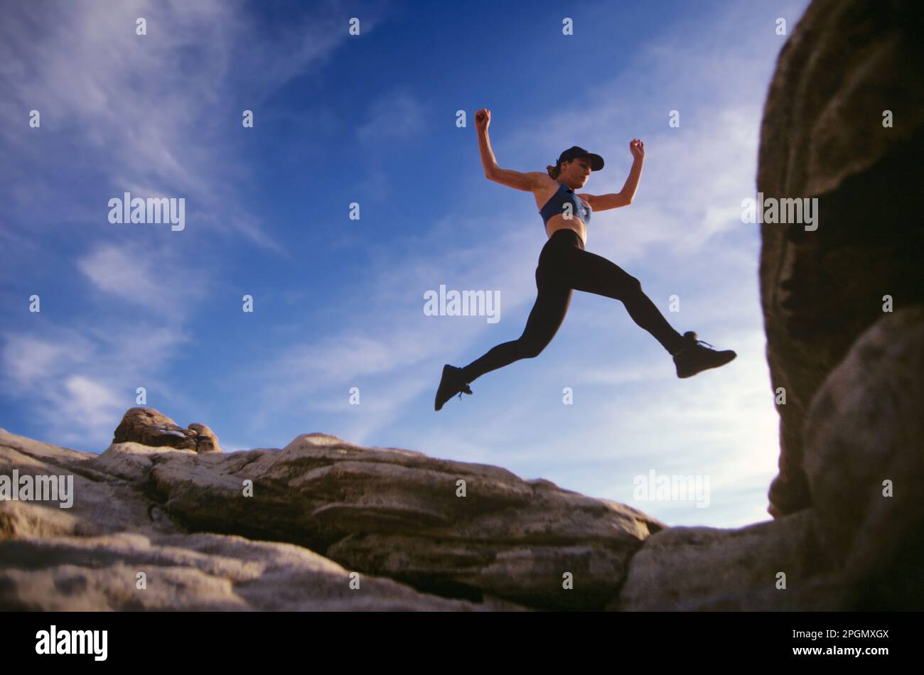 Woman rocks jump hi-res stock photography and images - Alamy