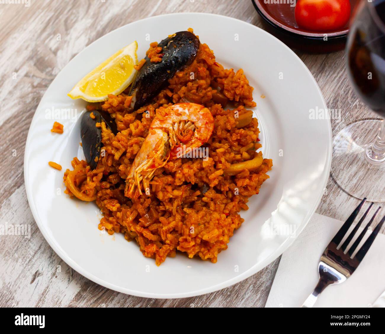 Spainsh dish seafood paella with rice, shrimps and mussels Stock Photo ...