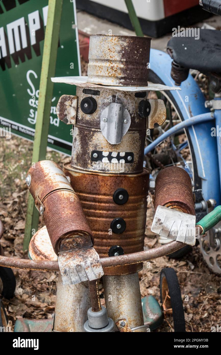 Junk sculpture made from old tin cans on display add a roadside stand ...