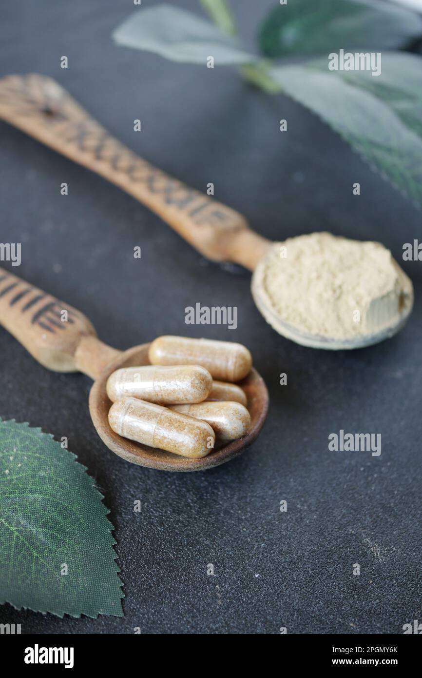 herbal medicine capsule on spoon Stock Photo - Alamy