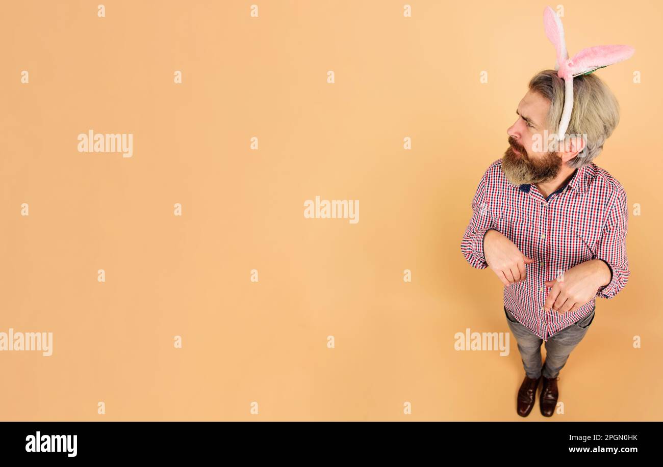 Easter celebration. Bearded man in bunny ears. Rabbit man. Easter man. Bearded guy in bunny mask ...