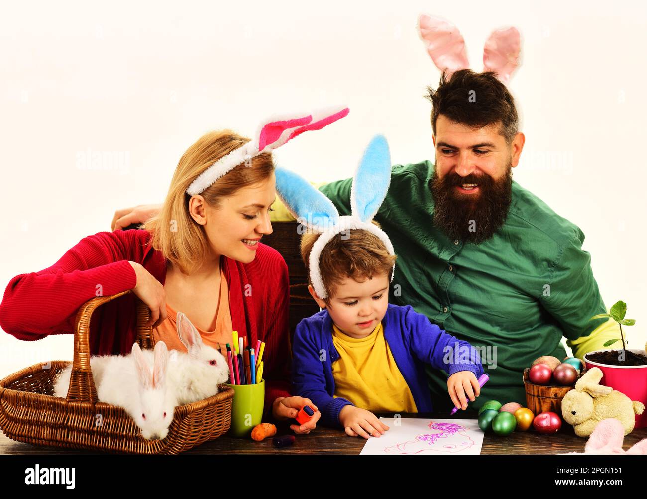 Mother, father and son preparing for Easter holiday. Easter family ...