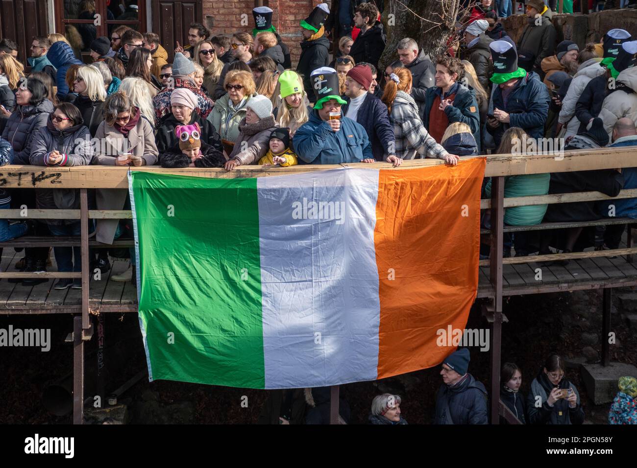 Boy with big hat drinking beer during Irish St. Patrick's Day ...