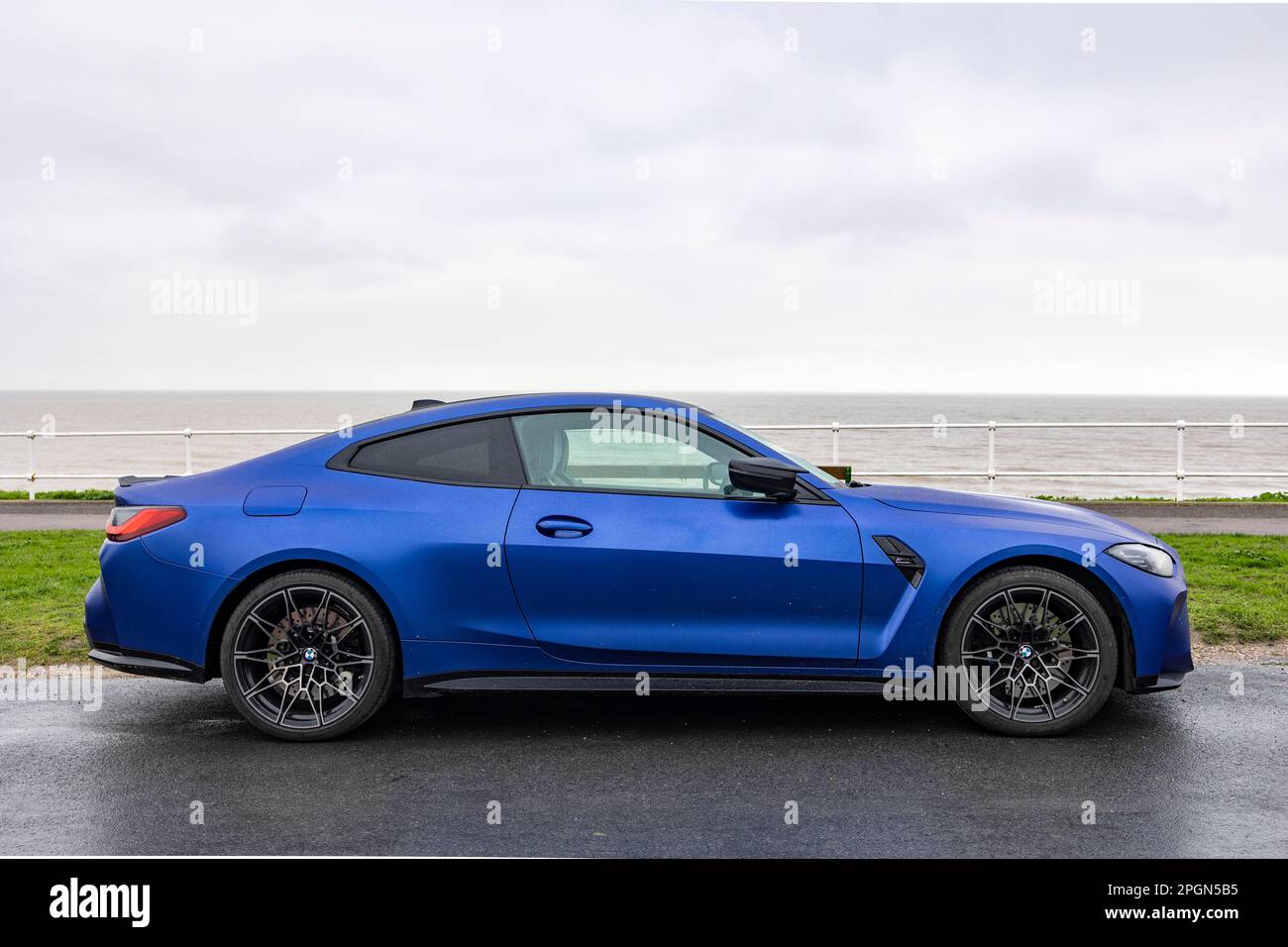 blue bmw sports car side on view Stock Photo - Alamy