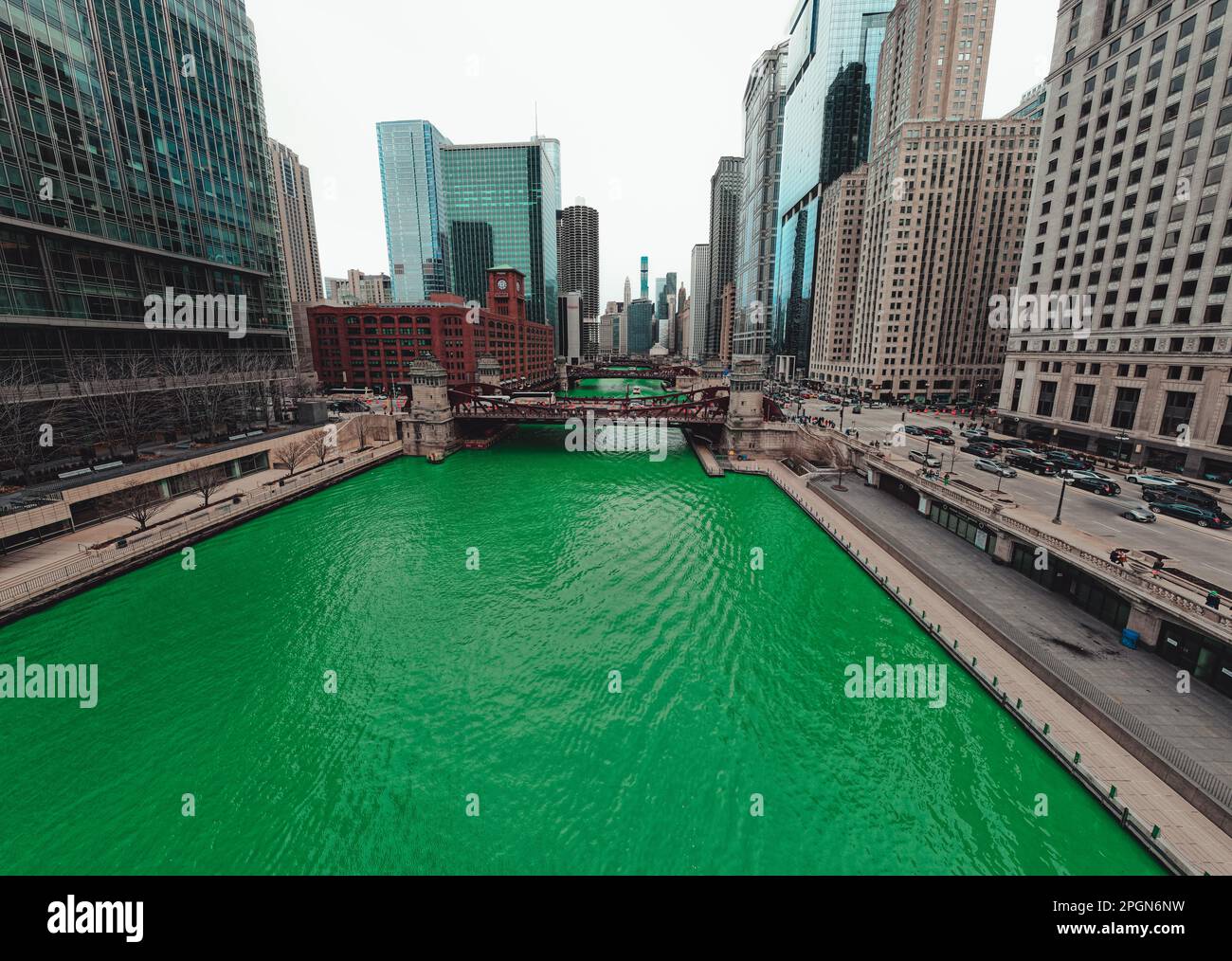 A breathtaking view of the Chicago river in its vibrant emerald hue ...