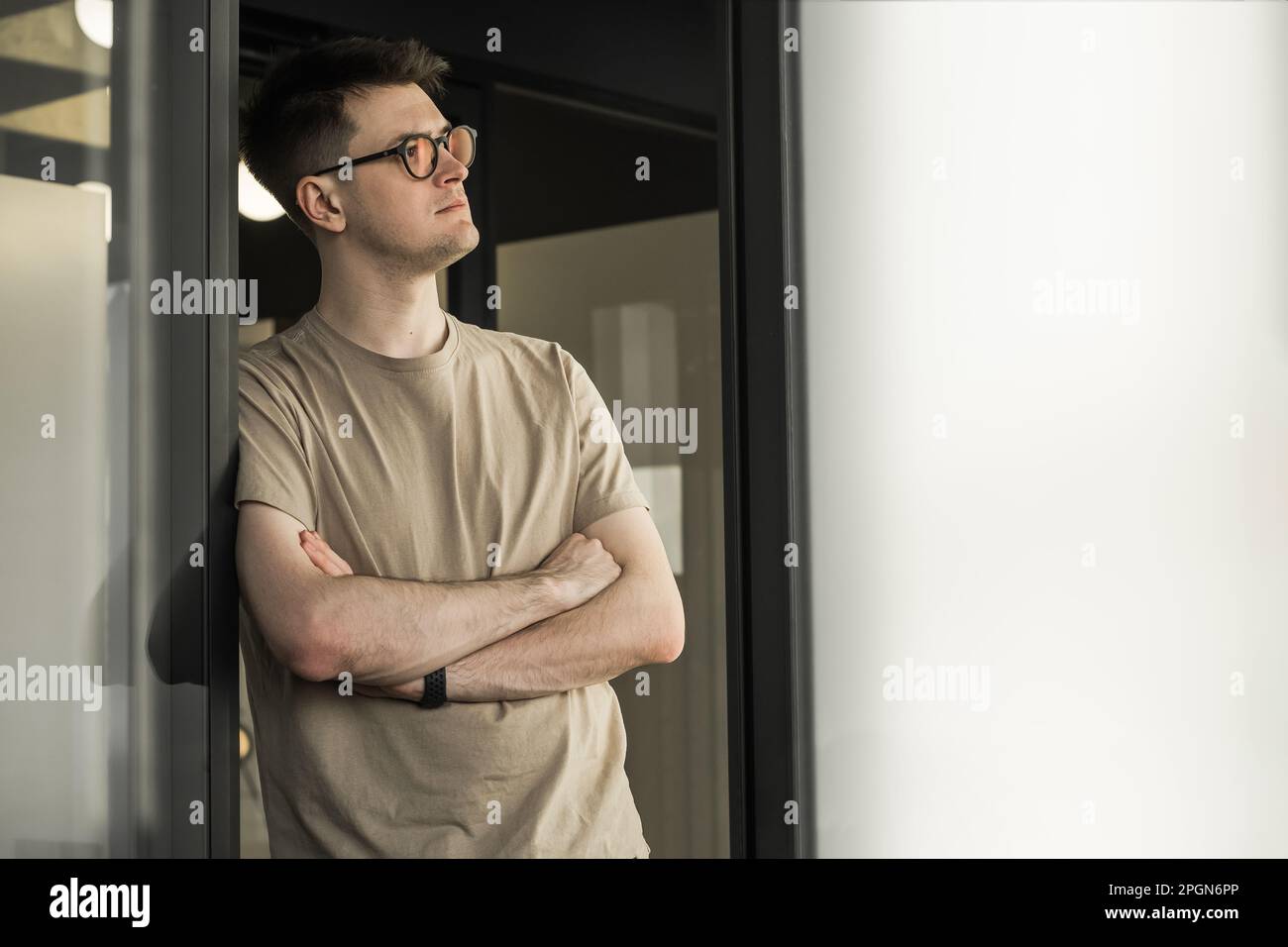 Portrait of a serious millennial male business owner in modern office ...