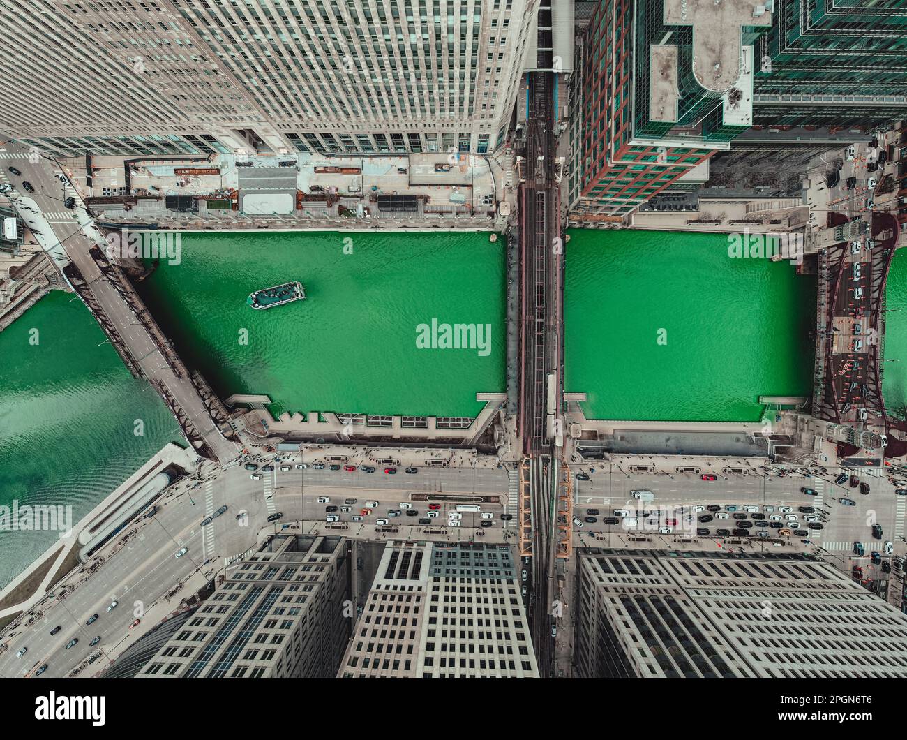A breathtaking view of the Chicago river in its vibrant emerald hue ...