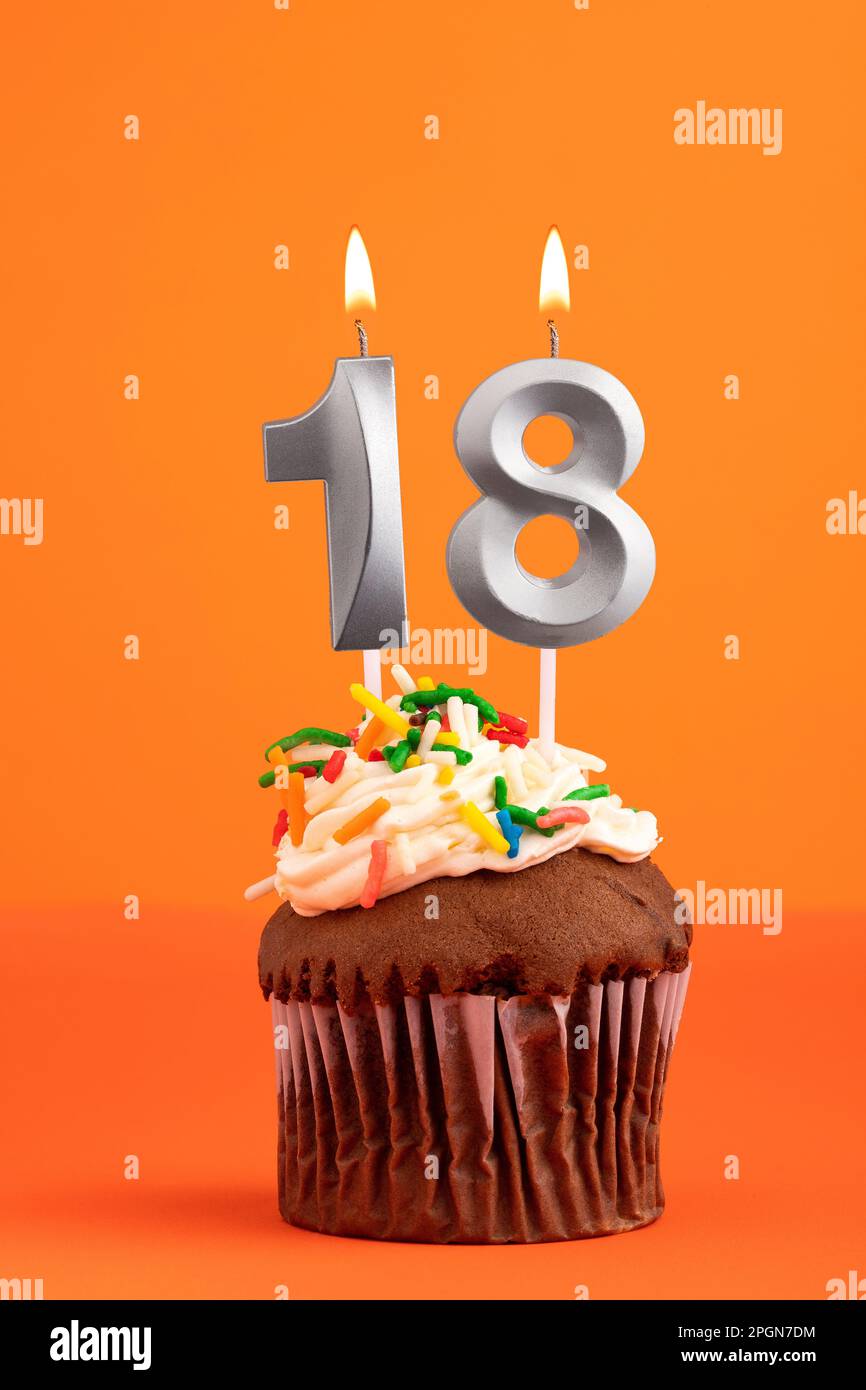 Birthday cake with candle number 18 - Orange foamy background Stock ...