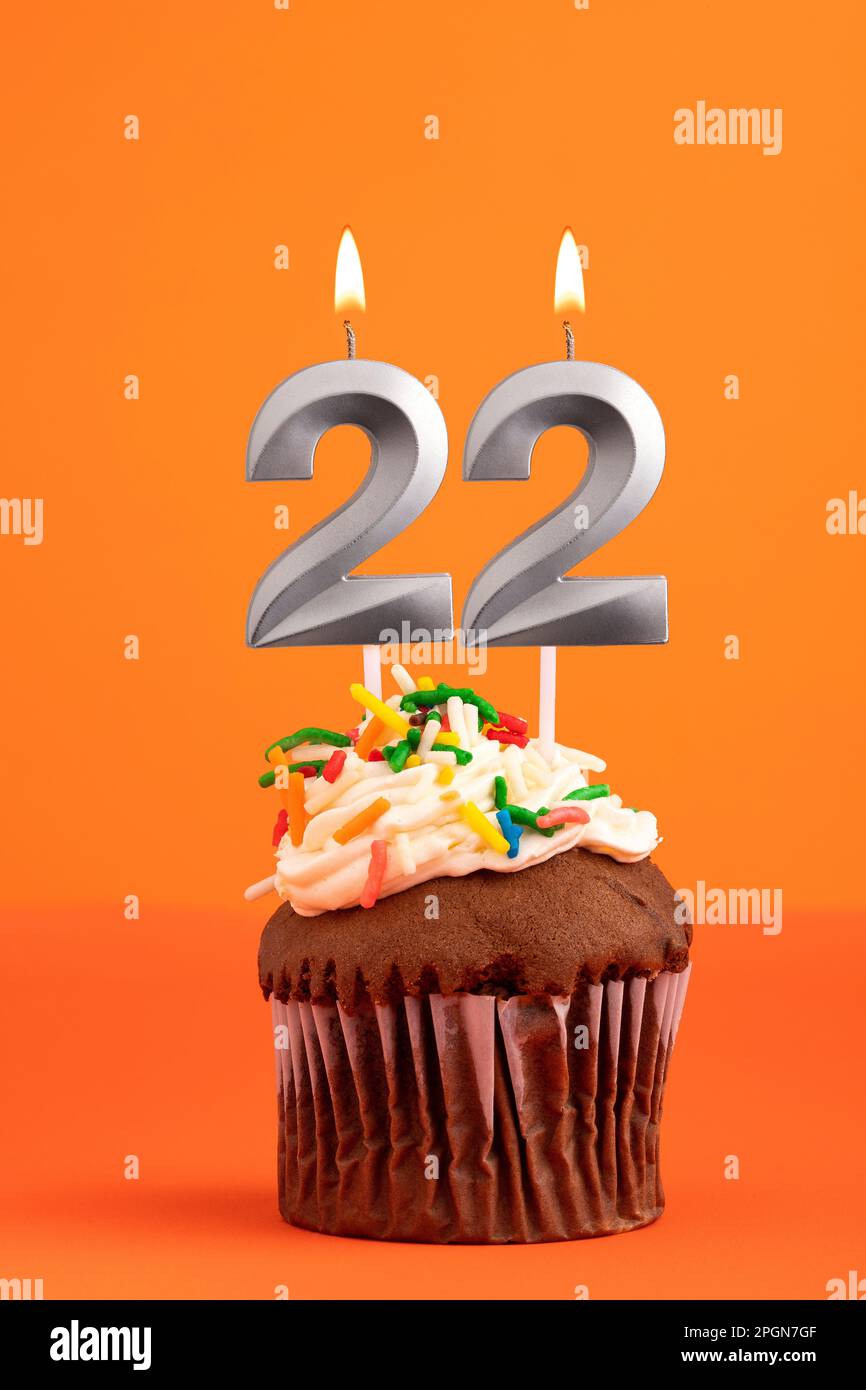 Birthday cake with candle number 22 - Orange foamy background Stock ...