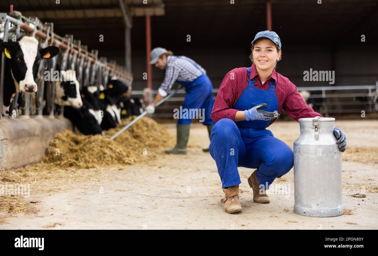 Woman carrying hay cattle hi-res stock photography and images - Alamy