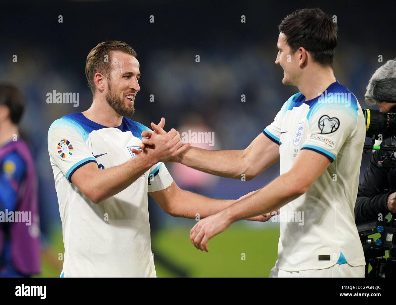 England's Harry Kane (left) and Harry Maguire celebrate the win after ...