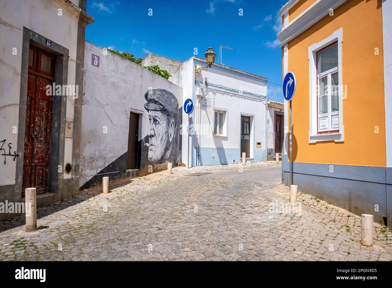 Lagos, Portugal, mural of an old man in a hat smoking a cigarette Stock ...