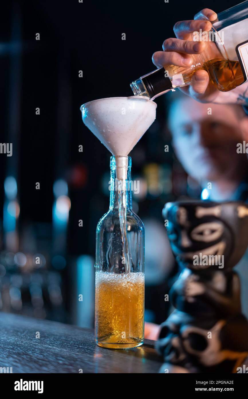 Whisky bottle hands hi-res stock photography and images - Alamy