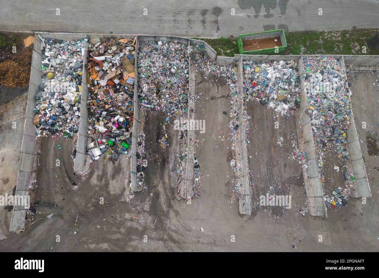 Landfill site, a pile of stinky different junk disposal in the concrete ...