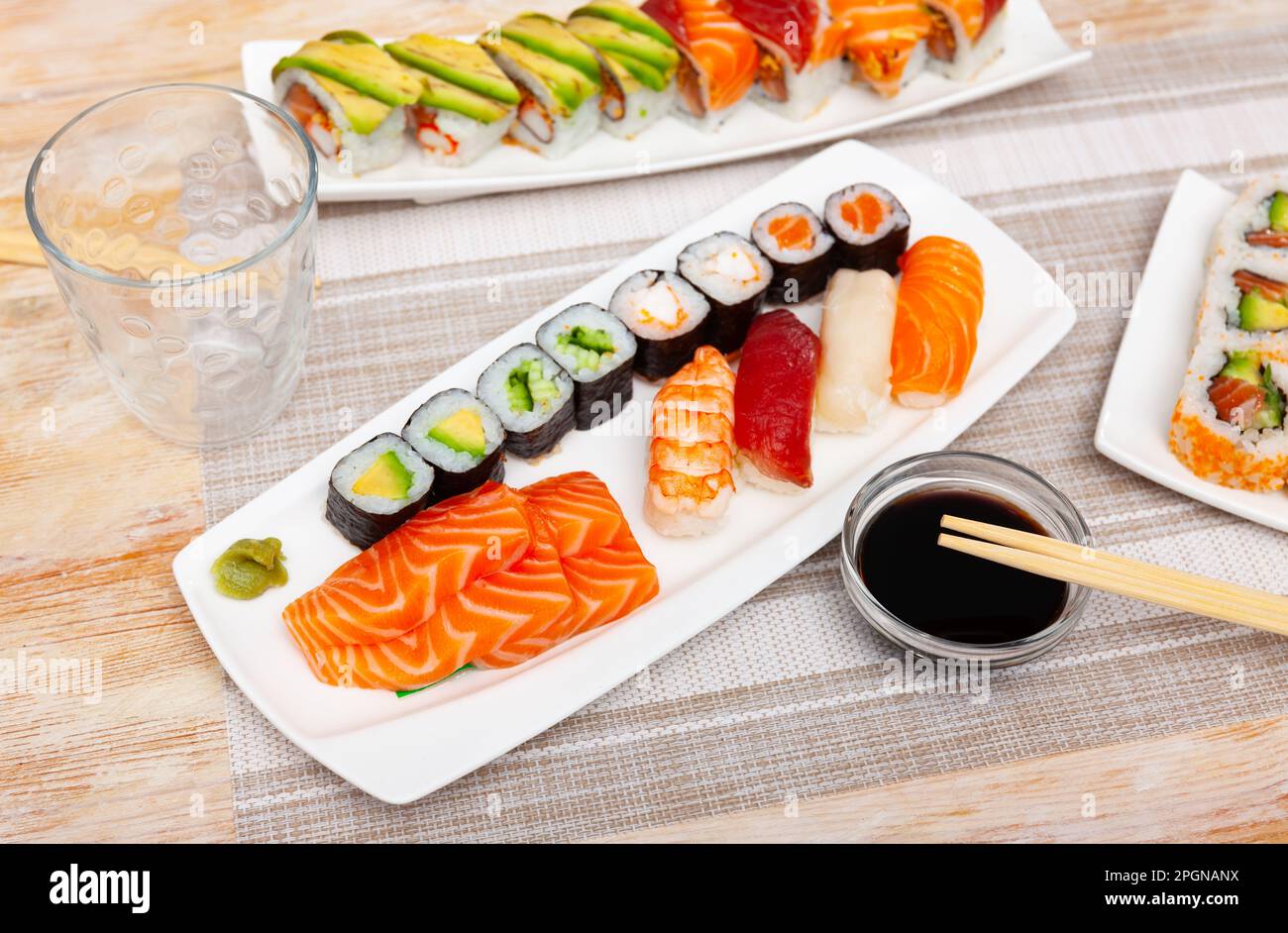 Different types of sushi and sashimi on table Stock Photo - Alamy