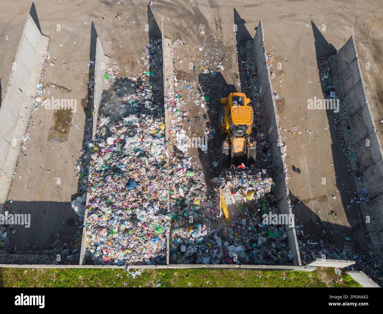 Landfill site, a pile of stinky different junk disposal in the concrete ...
