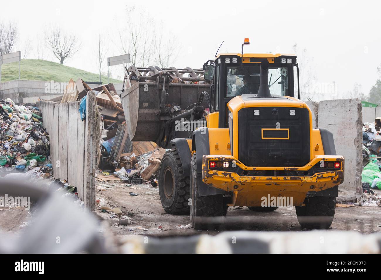 Heavy construction machine, front end loader moving along recycling ...
