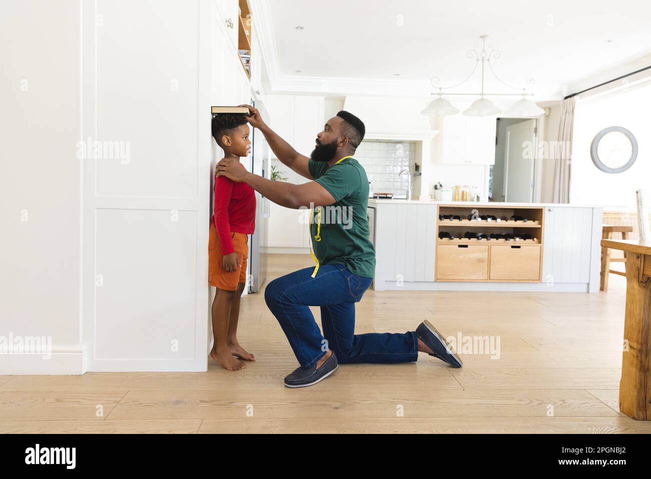 Father measuring height son hi-res stock photography and images - Alamy