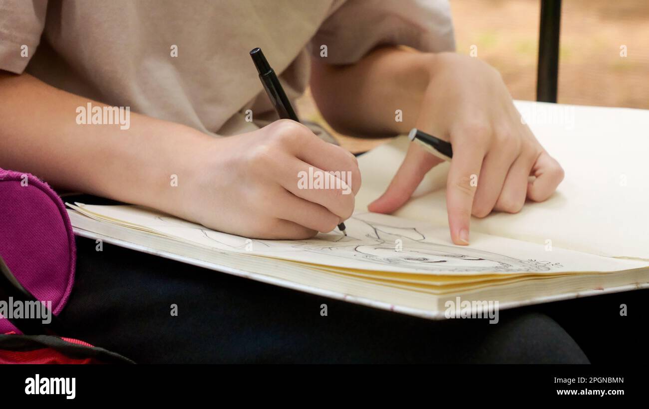 Teenager Drawing Something