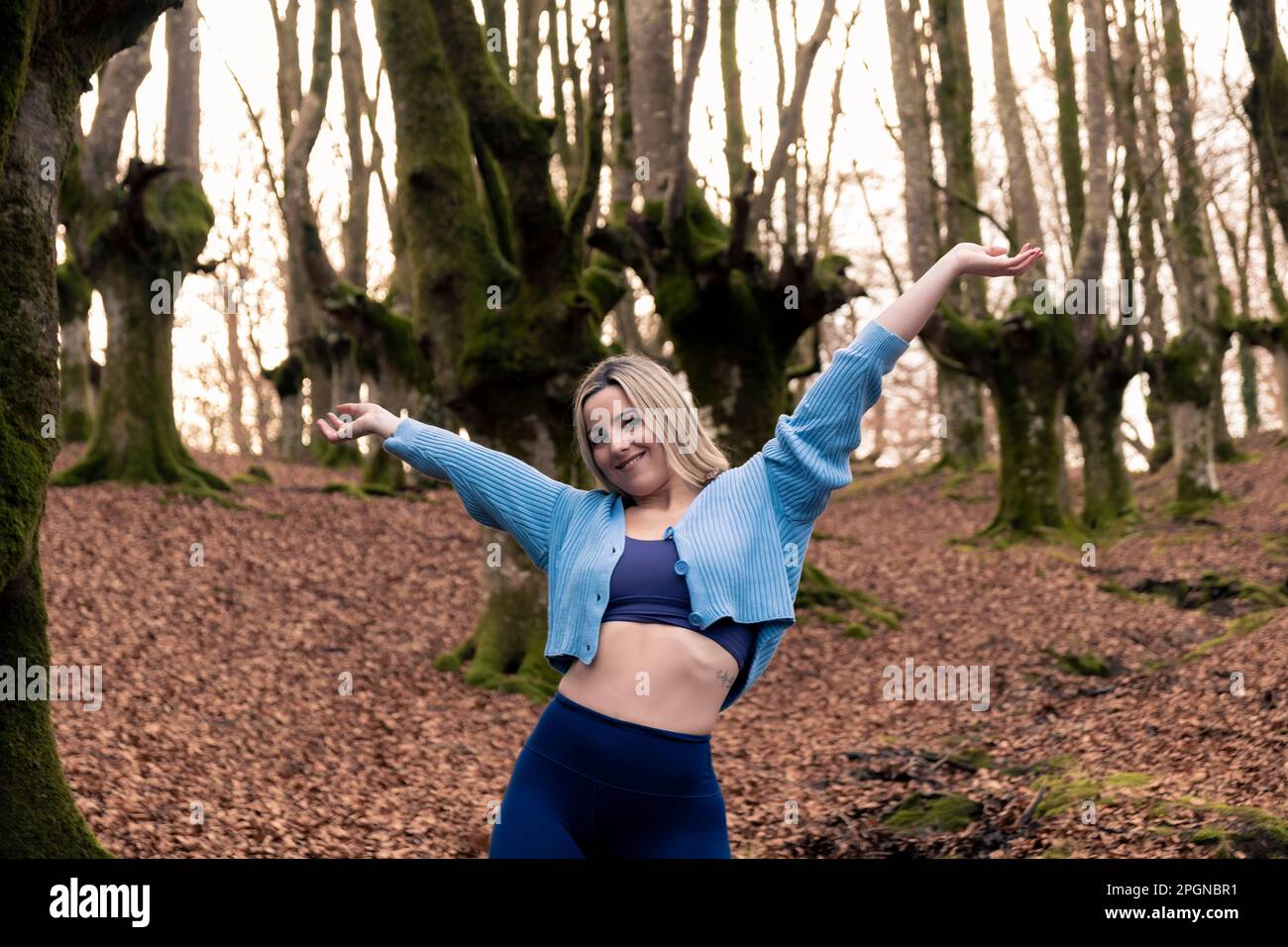 Free Spirit: Blonde Celebrating Life in the Rustling Leaves Stock Photo ...