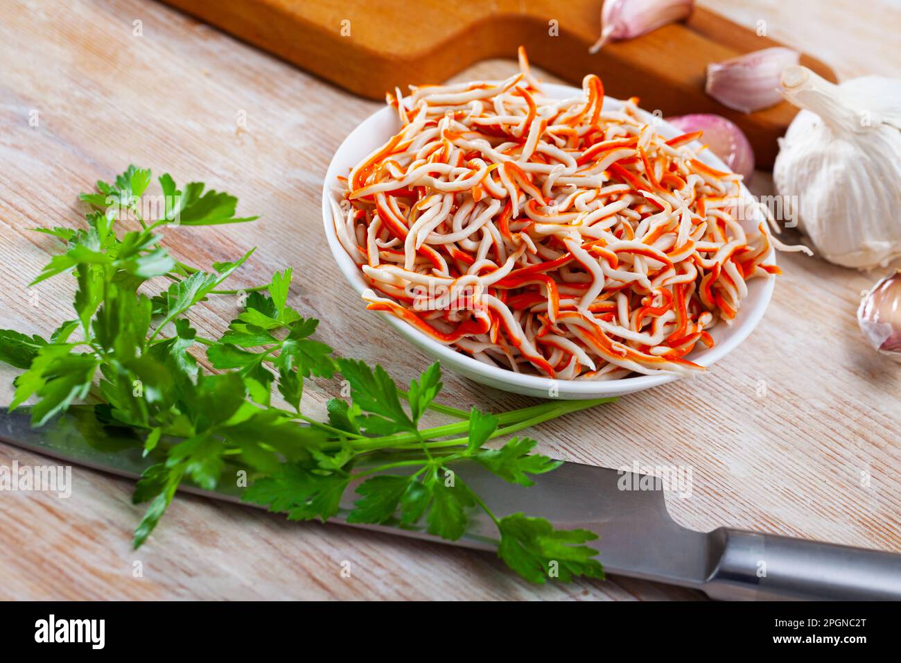 Raw Angula eel fry ready for cooking on table Stock Photo - Alamy