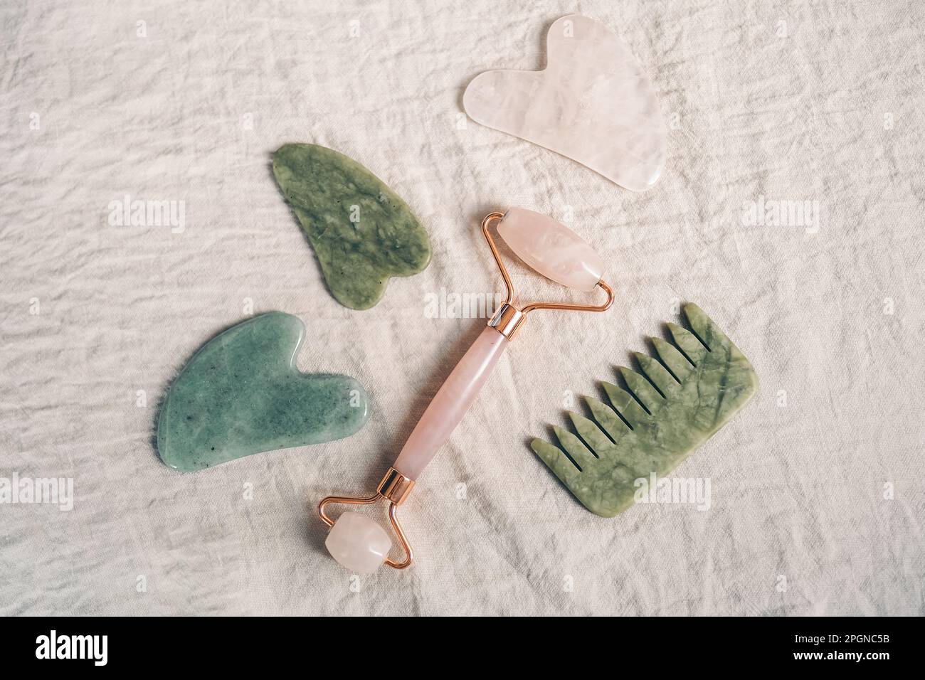 Natural stone gua sha tools for facial acupuncture massage Stock Photo ...