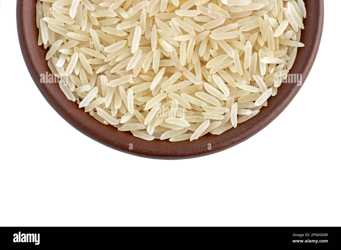 Healthy basmati rice in a clay ceramic bowl close-up isolated on white ...