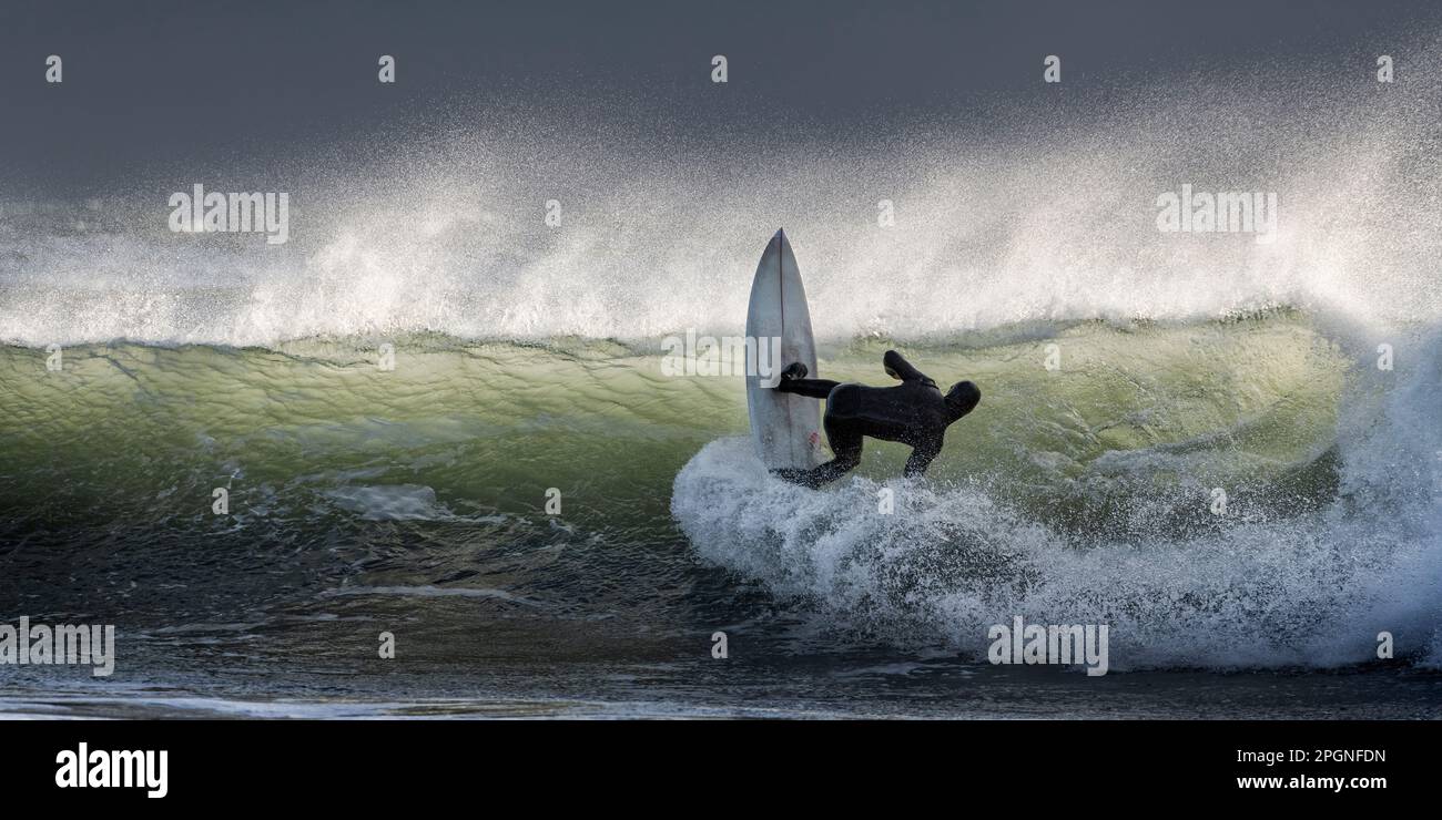 Man surfboarding on waves in sea at vacation Stock Photo - Alamy
