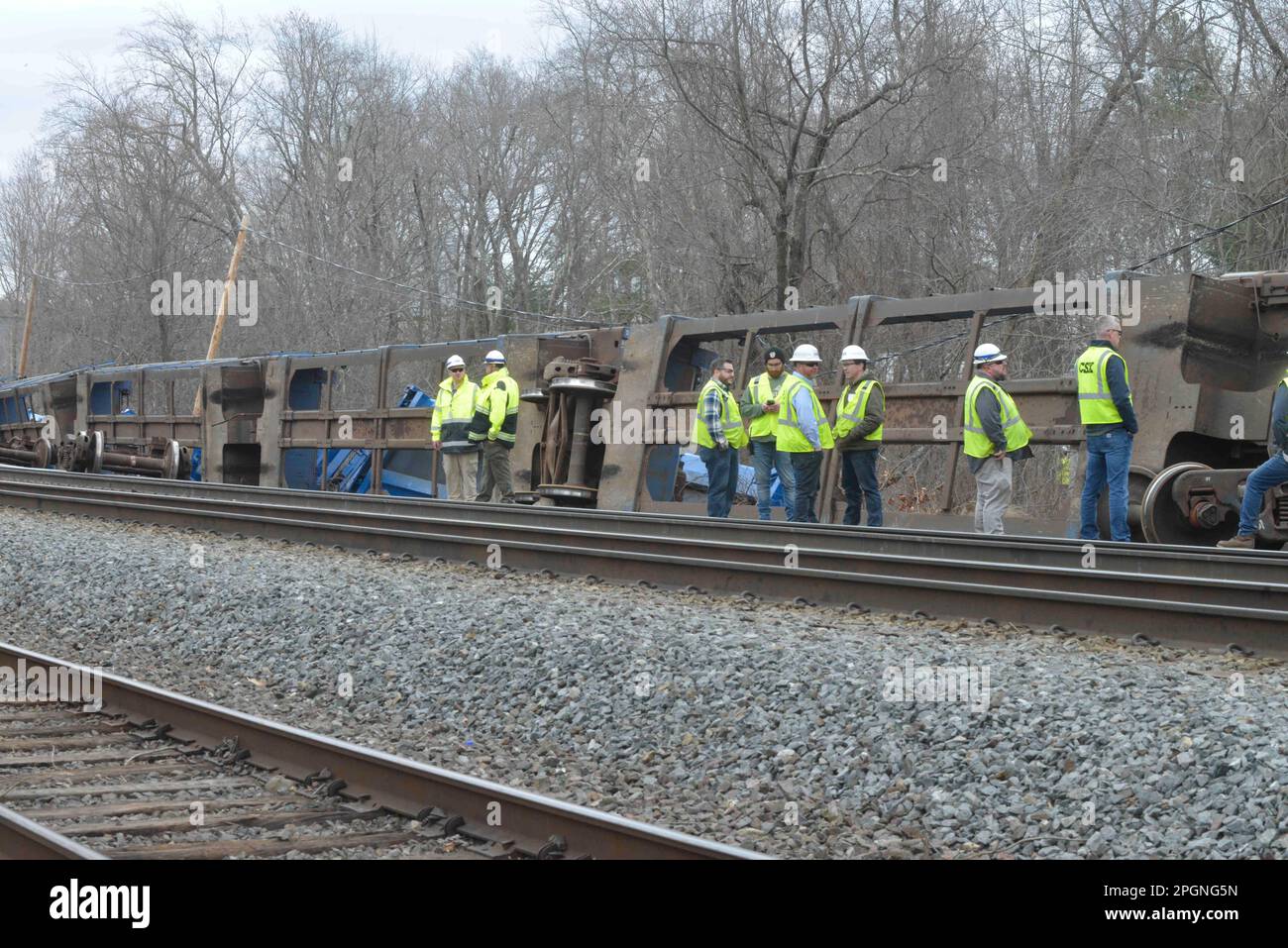 Ayer, Massachusetts, USA. 24th Mar, 2023. Derailed train cars litter the railbed at a derailment ...