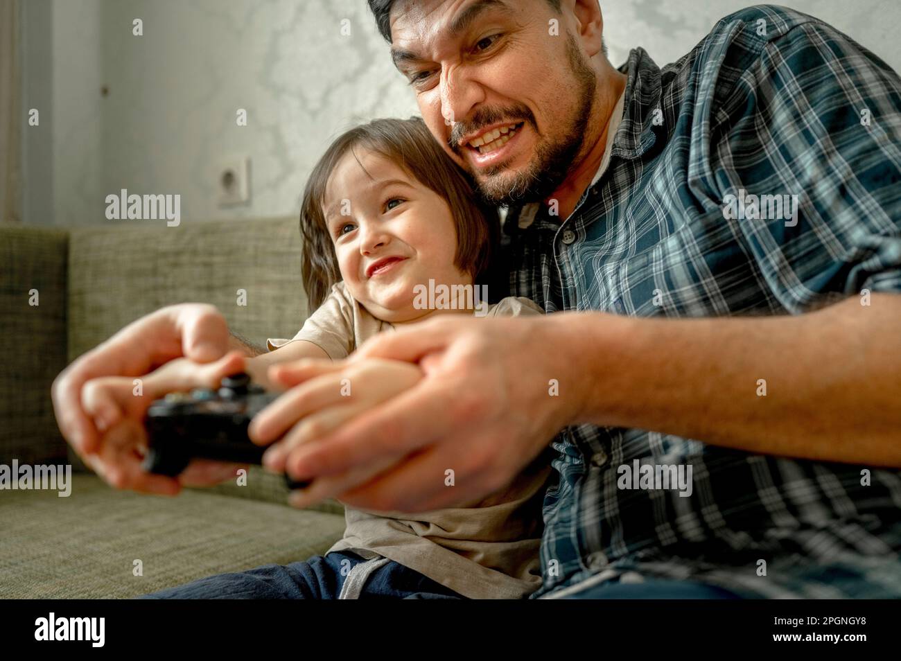 Father and son playing video games hi-res stock photography and images ...