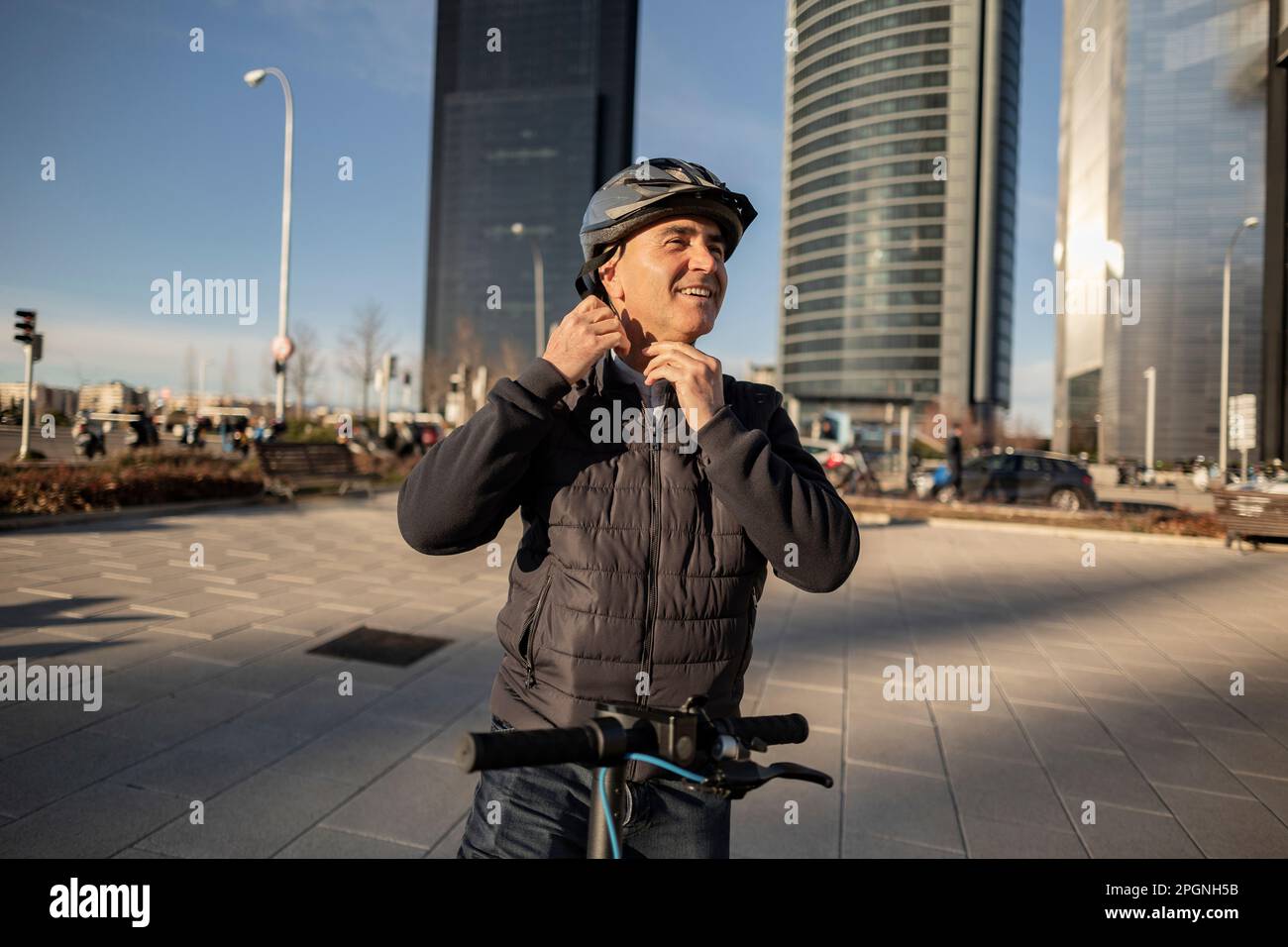 Adjusting helmet hi-res stock photography and images - Alamy