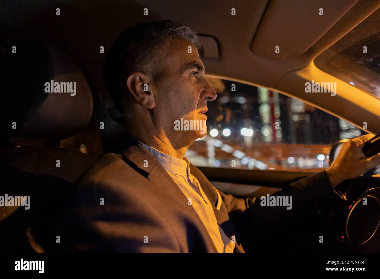 Car interior man driving night hi-res stock photography and images - Alamy
