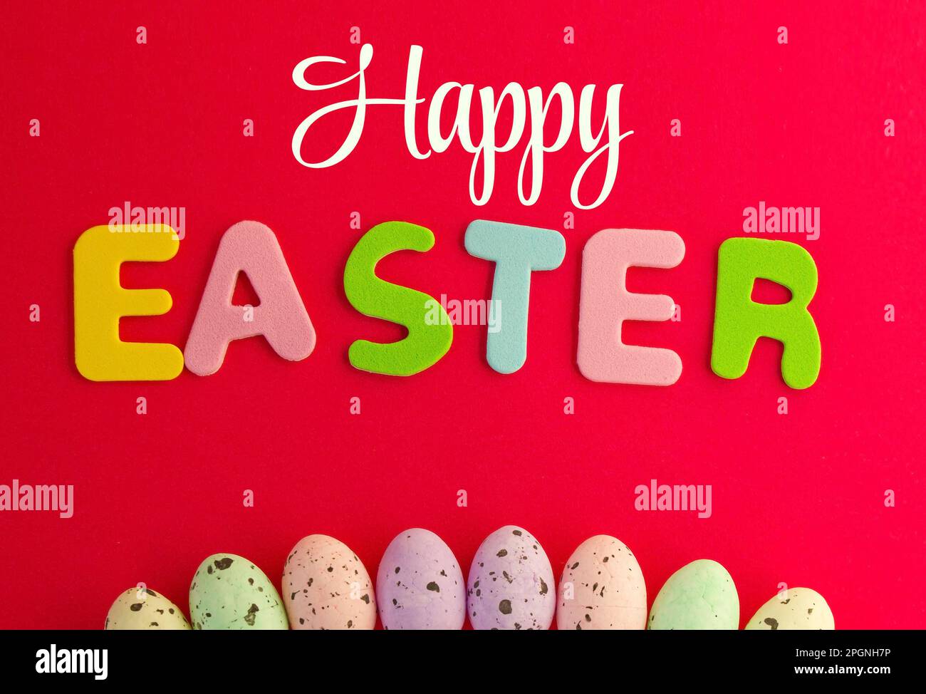 Happy Easter text with red background decorated with chocolate eggs ...