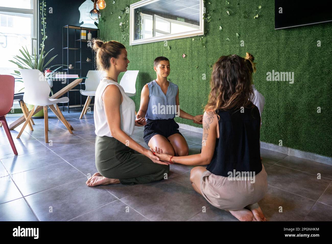Business people meditating at workplace in break time Stock Photo - Alamy