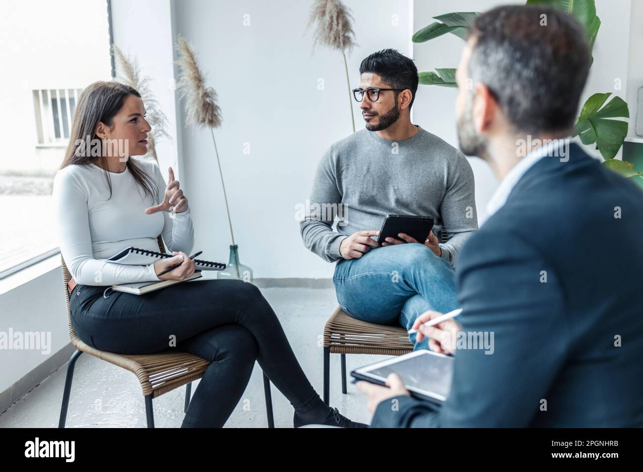 Business people having meeting together at workplace Stock Photo - Alamy