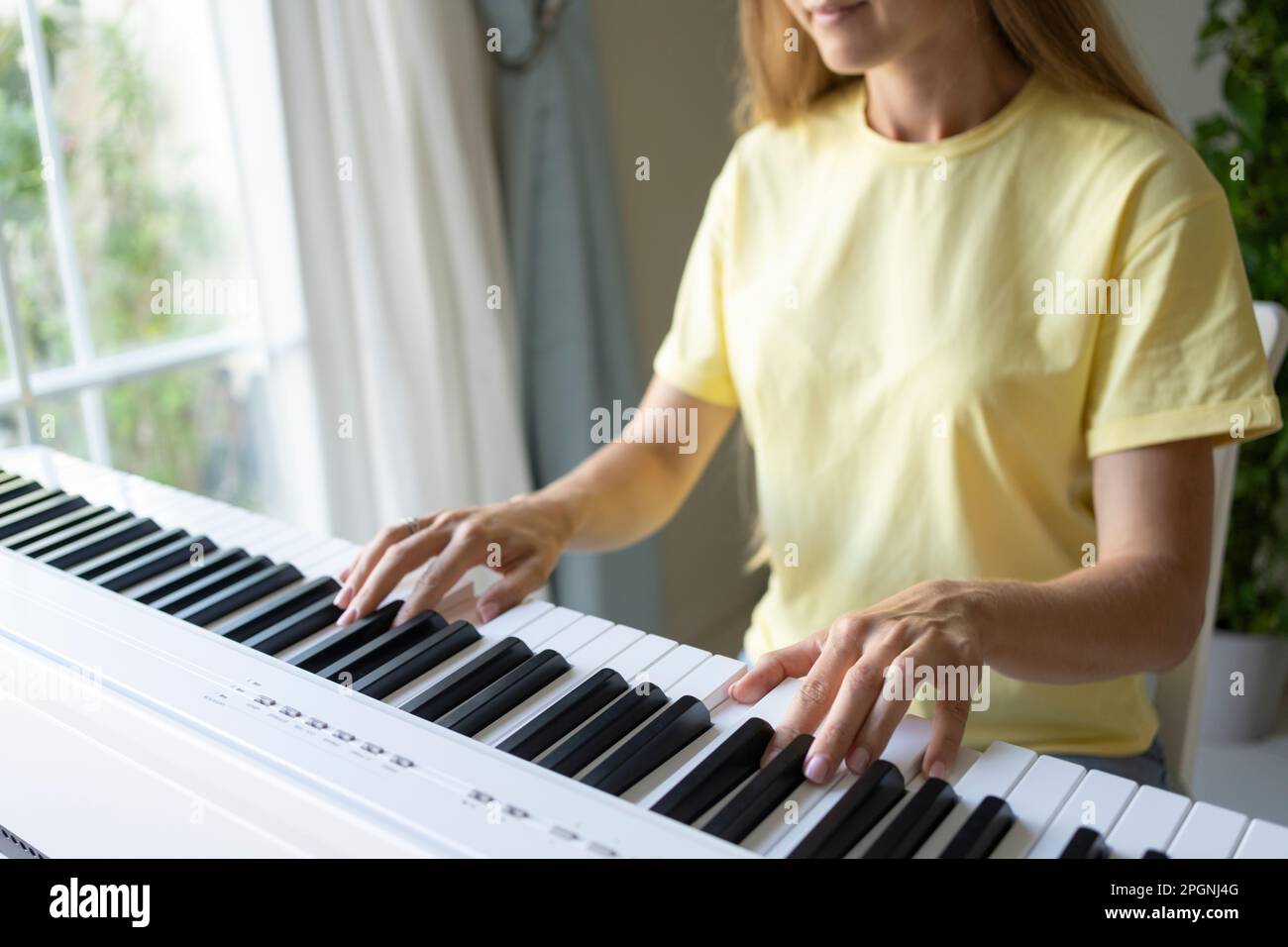 Woman hands playing piano hi-res stock photography and images - Alamy