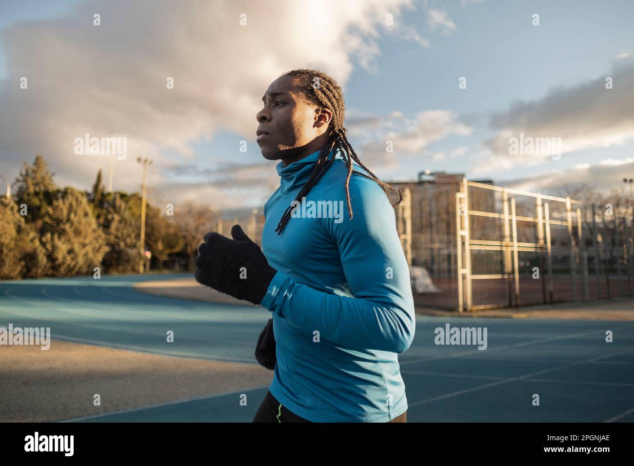 Athlete runner male track side quarter hi-res stock photography and ...