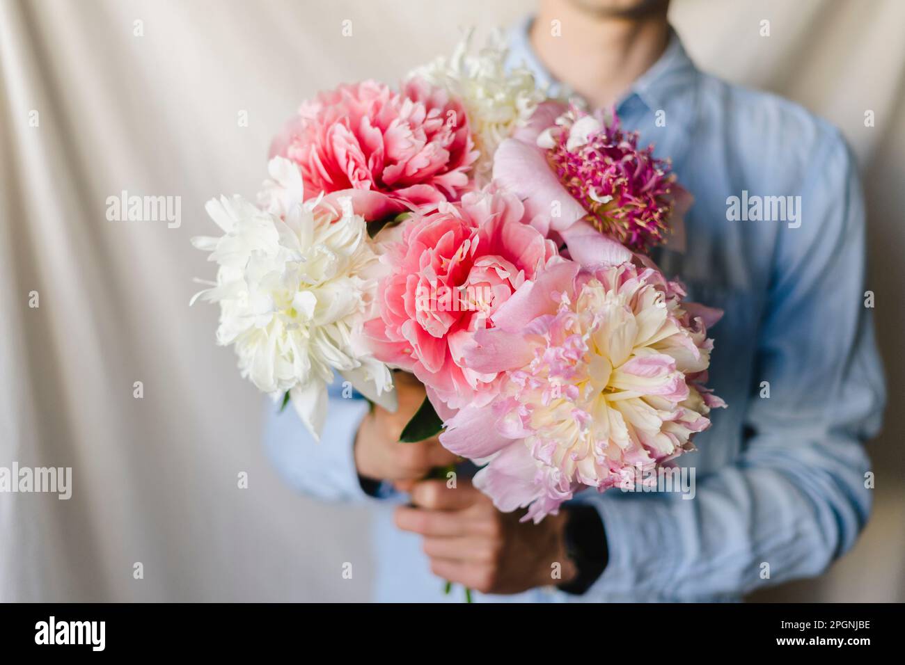Man hand with flowers hi-res stock photography and images - Alamy