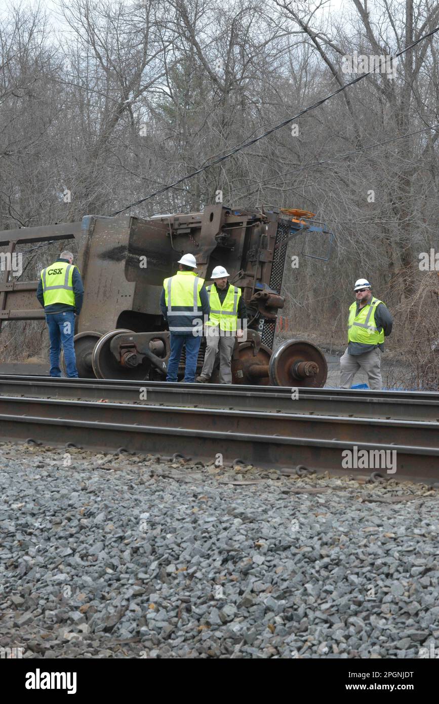 Ayer, Massachusetts, USA. 24th Mar, 2023. Derailed train cars litter ...