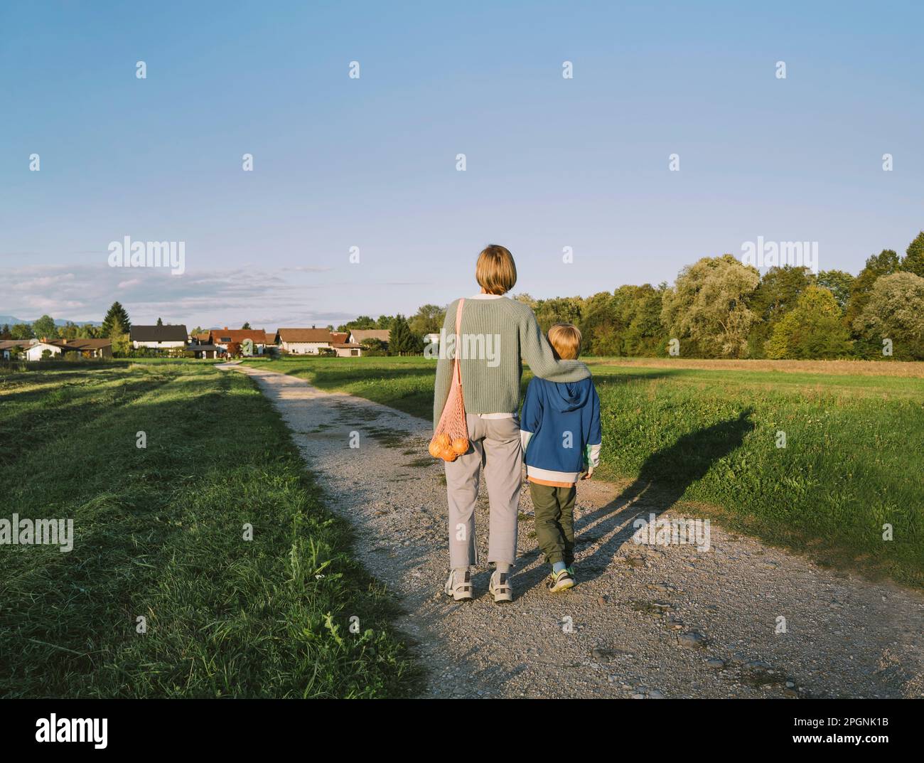 Woman boy walking around field hi-res stock photography and images - Alamy