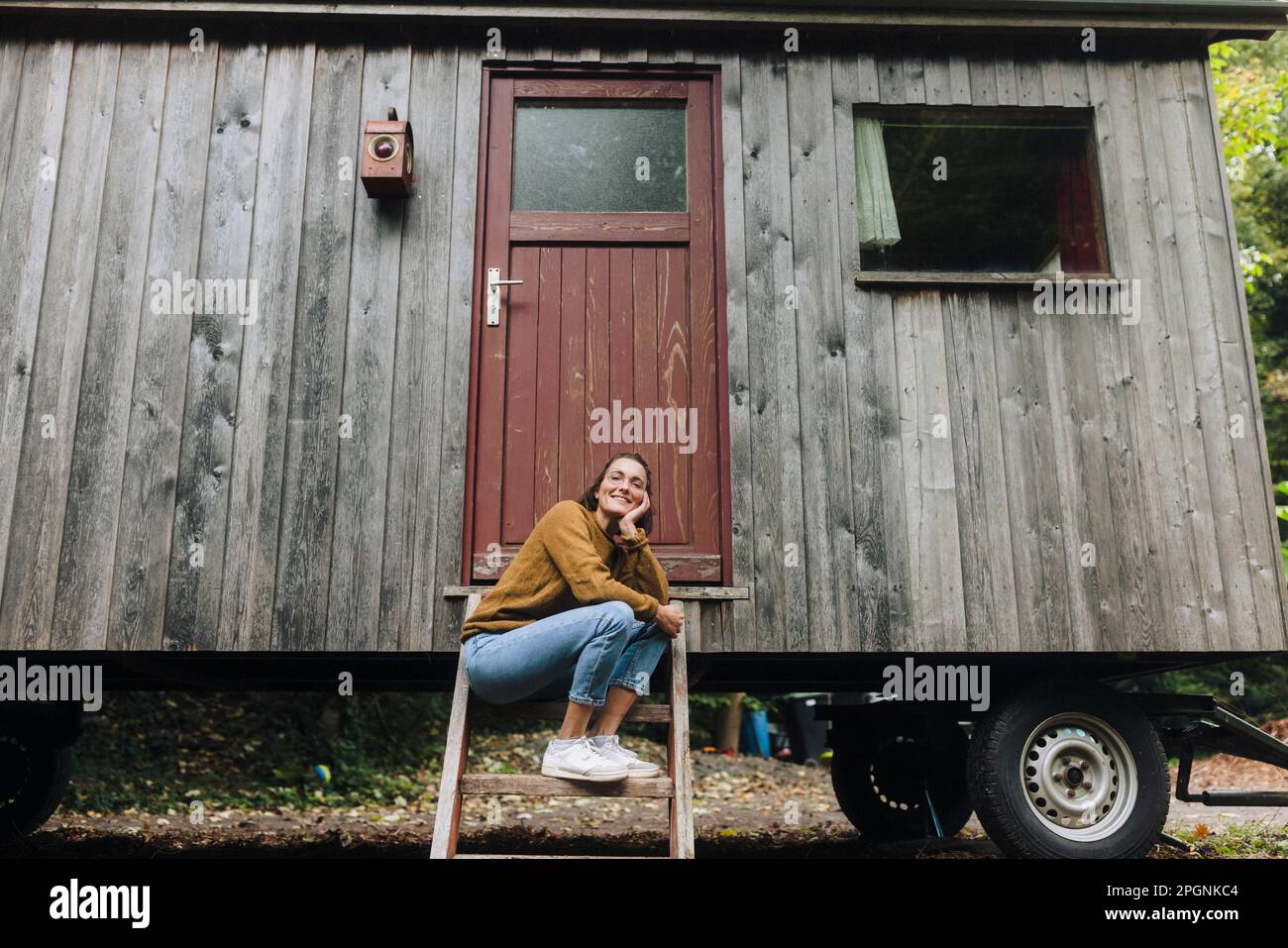Female sitting on cabin hi-res stock photography and images - Alamy