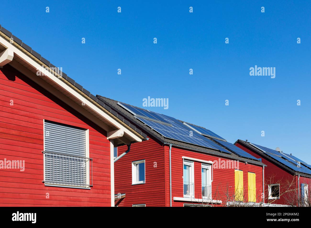 Germany, North Rhine Westphalia, Cologne, Row of red-painted wooden ...