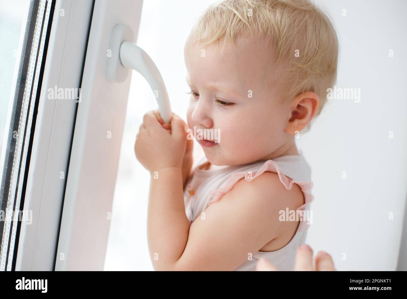 Protecting children from falling out of windows. An active little girl ...